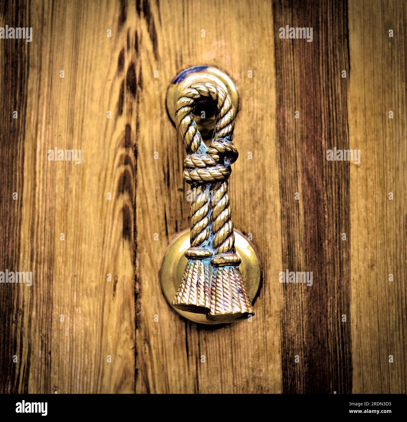 Decorative line, loop and tassels bronze ornamental door knocker with ...