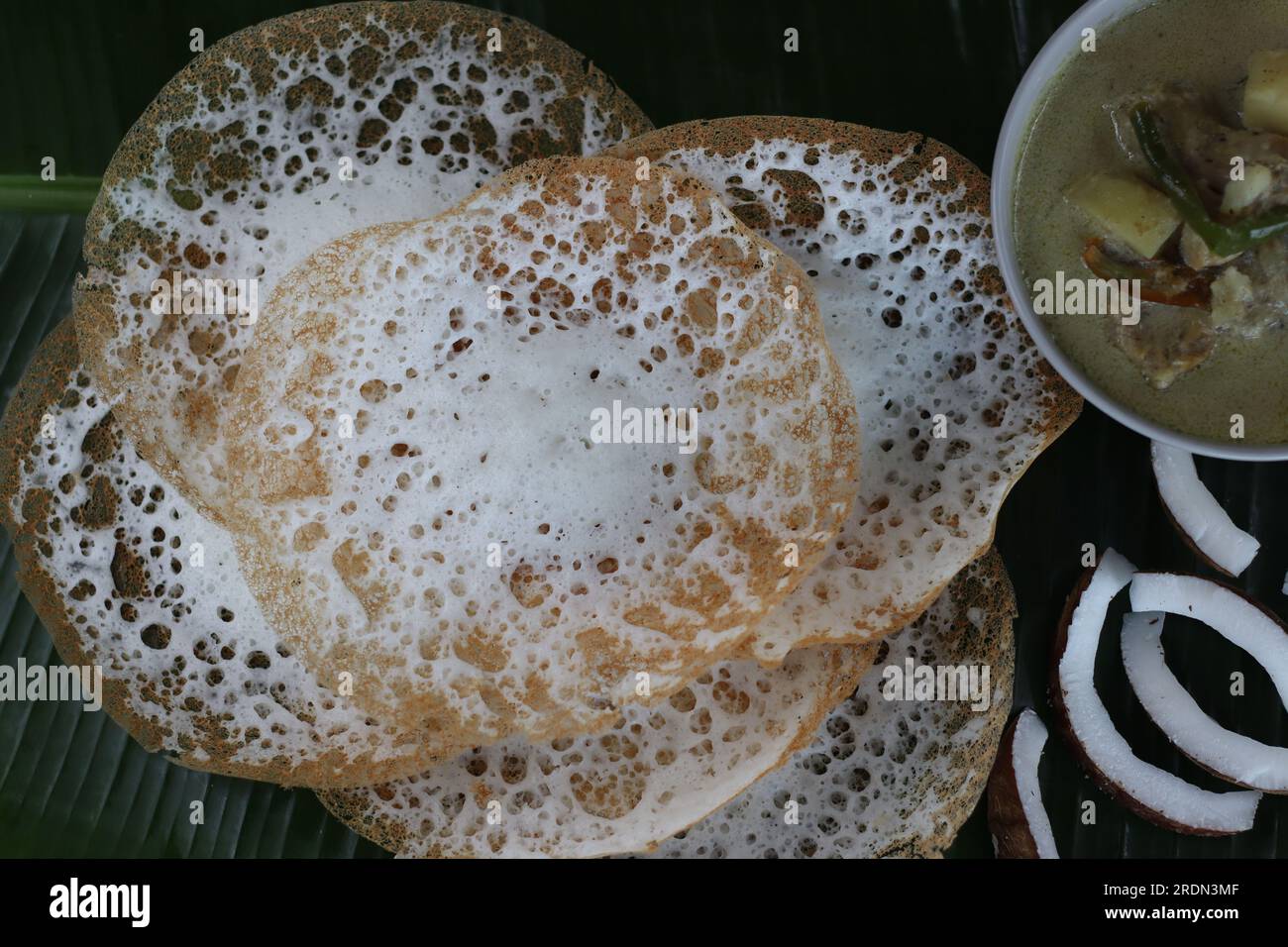 Laced Rice Crepes served with kerala style chicken stew. Fermented rice ...