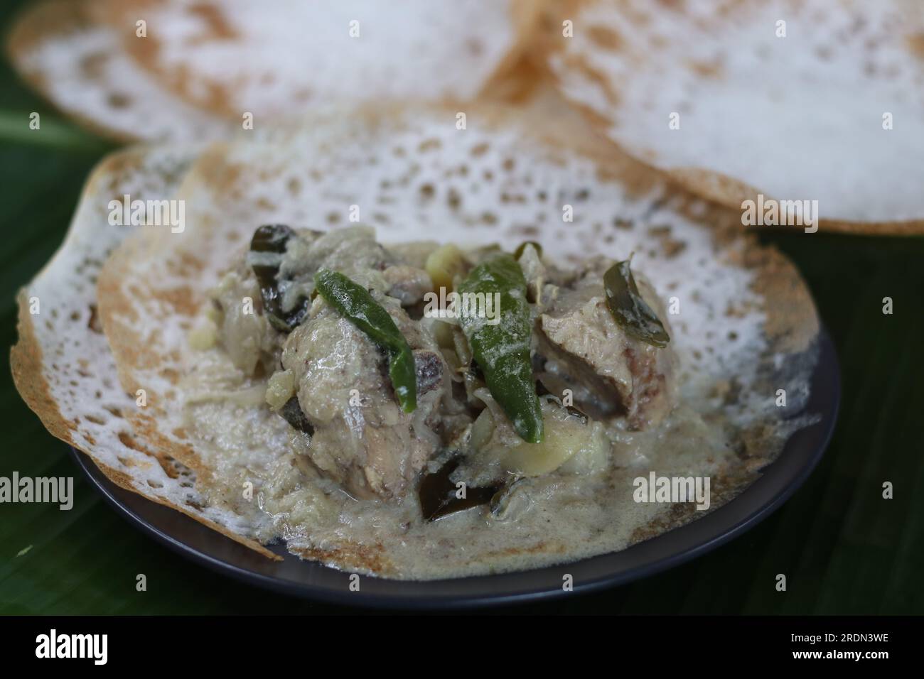 Laced Rice Crepes served with kerala style chicken stew. Fermented rice ...