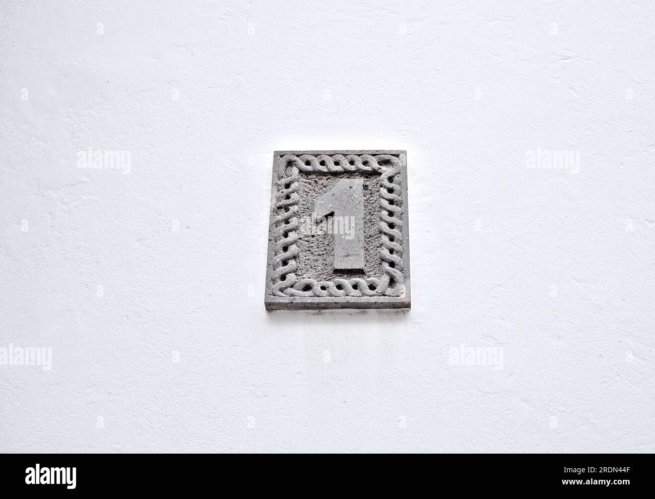 Number 1, one, stone relief on white background Stock Photo - Alamy