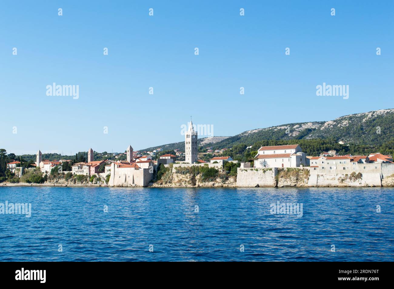 Historic arhitecture in Rab town, Croatia, with four church towers ...