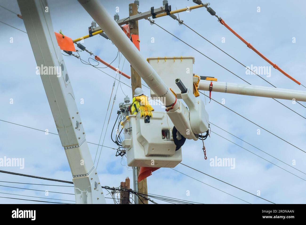 In aftermath of hurricane, service men are diligently repairing power ...