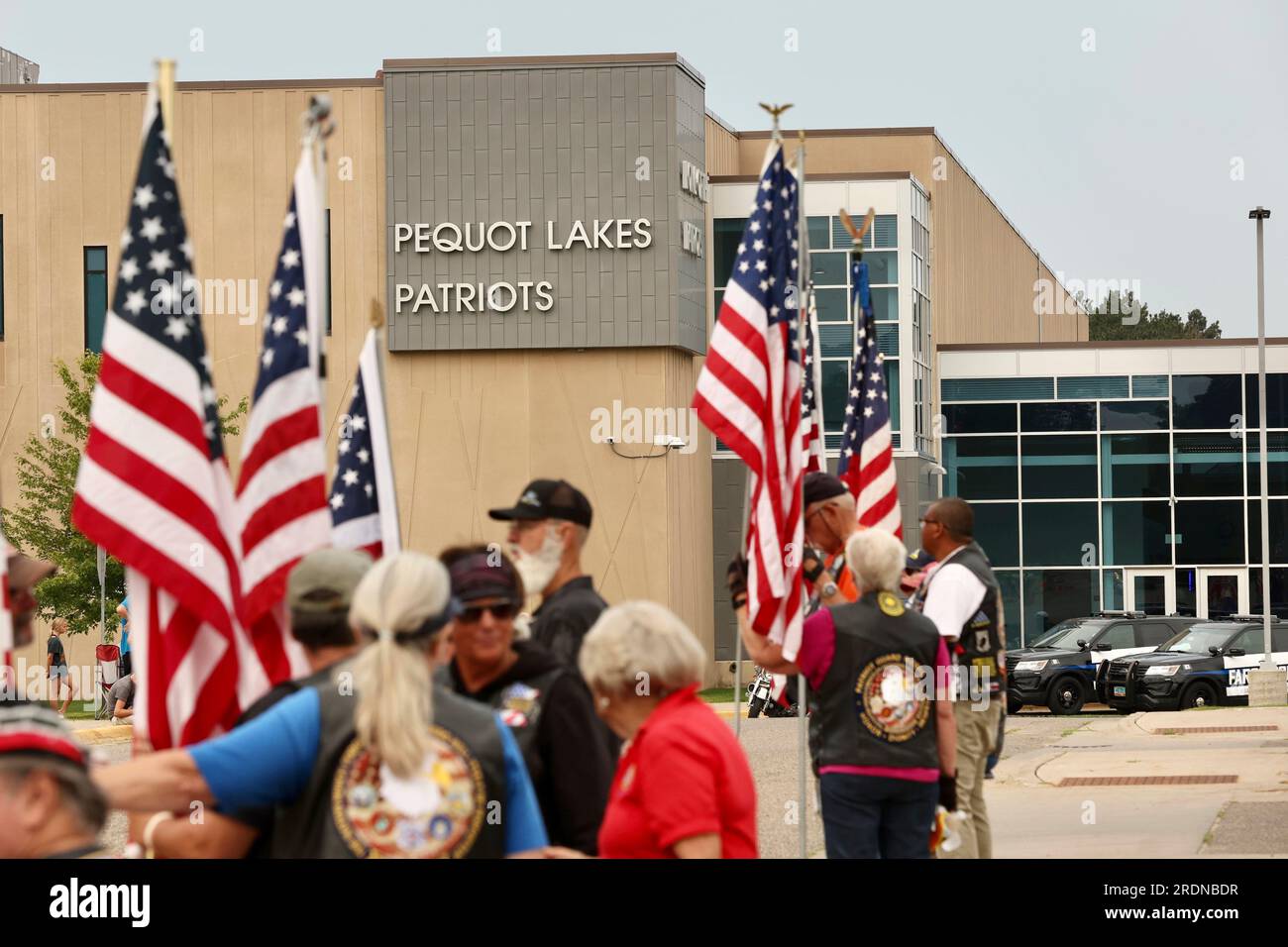 People stand outside during funeral services for Fargo Officer Jake ...