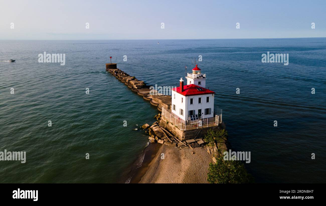 Aerial Photo of a Lighthouse on the Beach at Sunset Stock Photo - Alamy