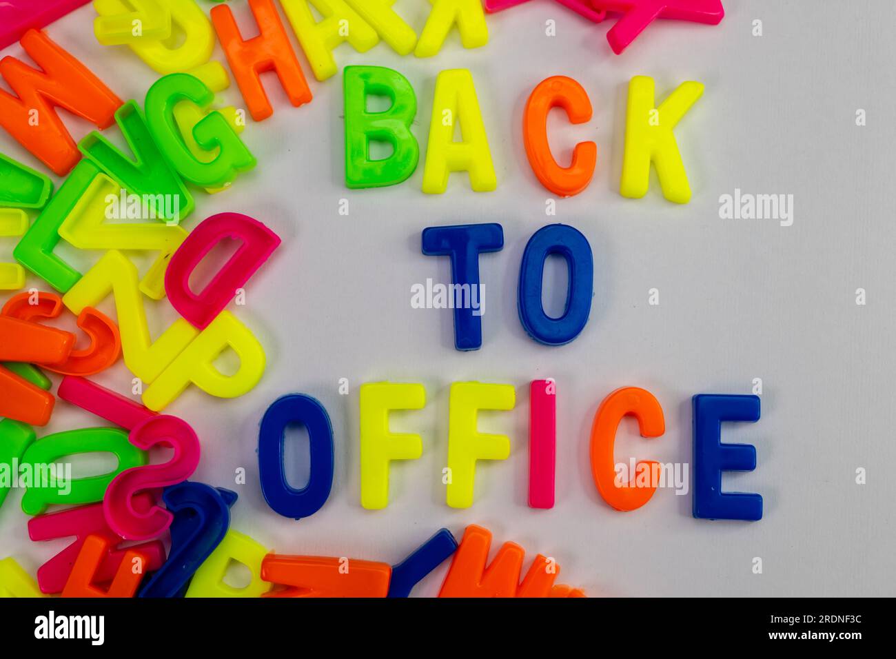 This stock image shows a set of colorful letter magnets spelling out ...