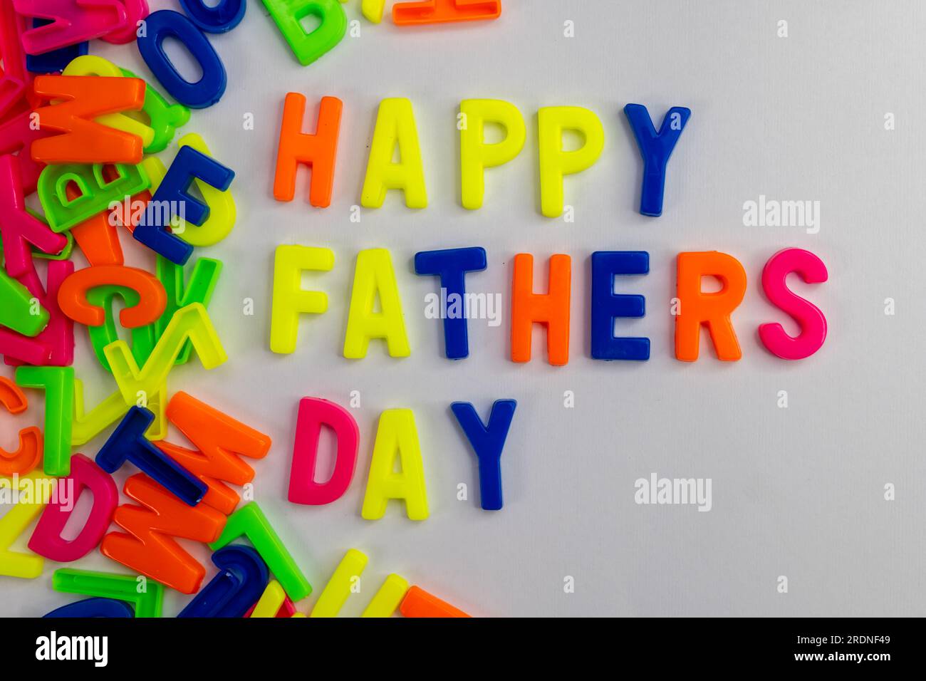 This stock image shows the words "Happy Fathers Day" made from colorful ...