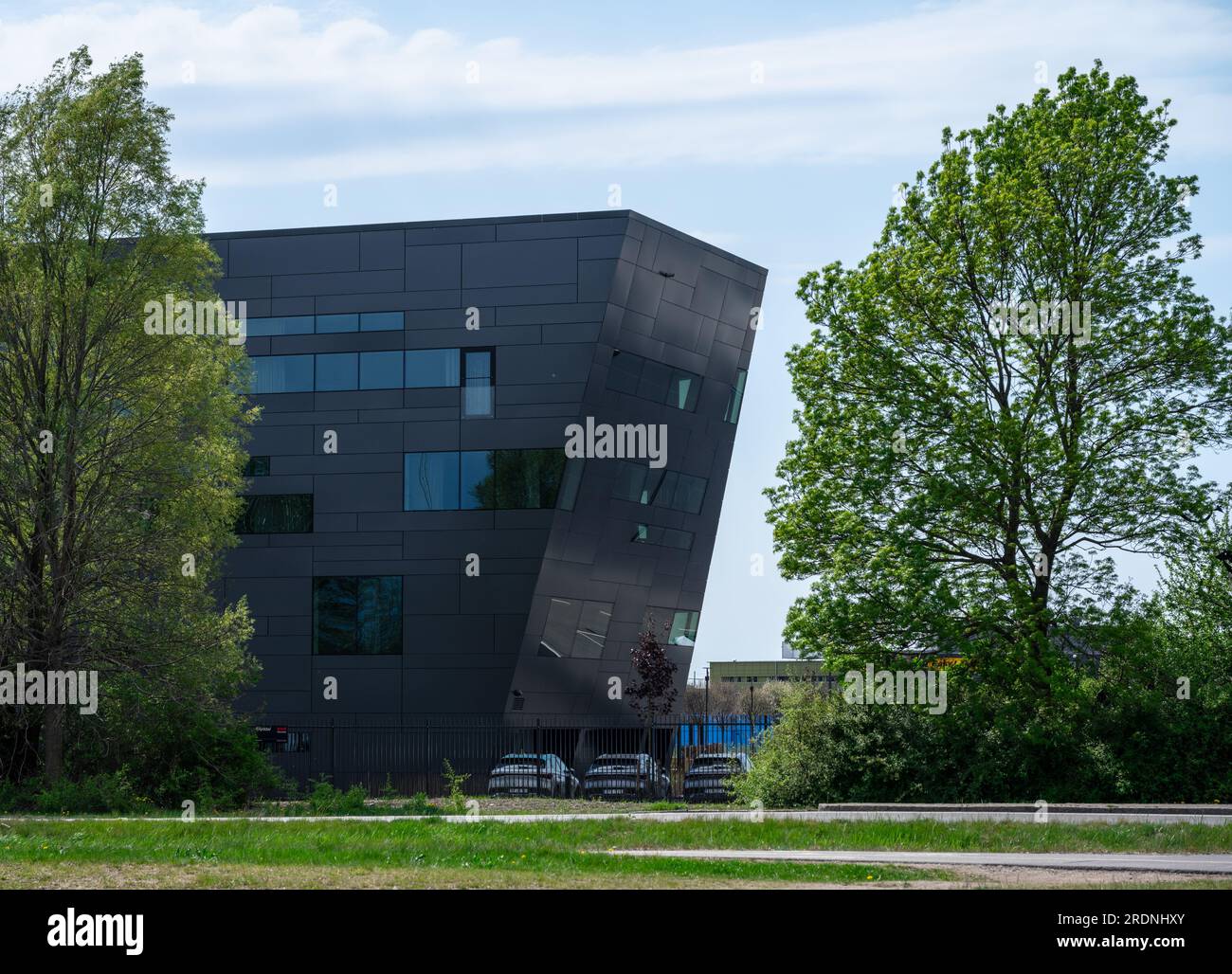 Large dark office building with odd angles Stock Photo - Alamy