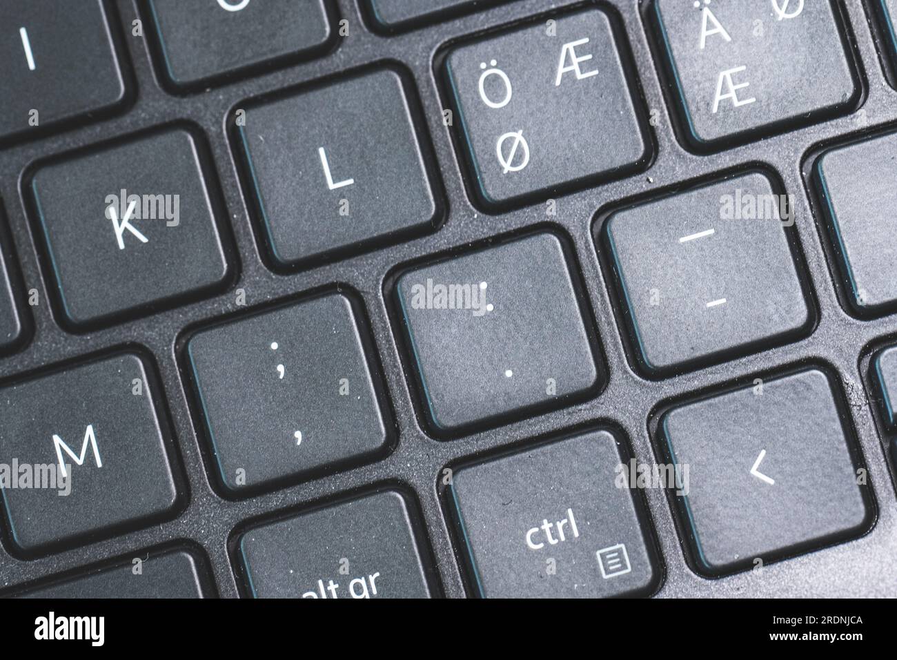 Punctuation keys on a black laptop keyboard Stock Photo - Alamy