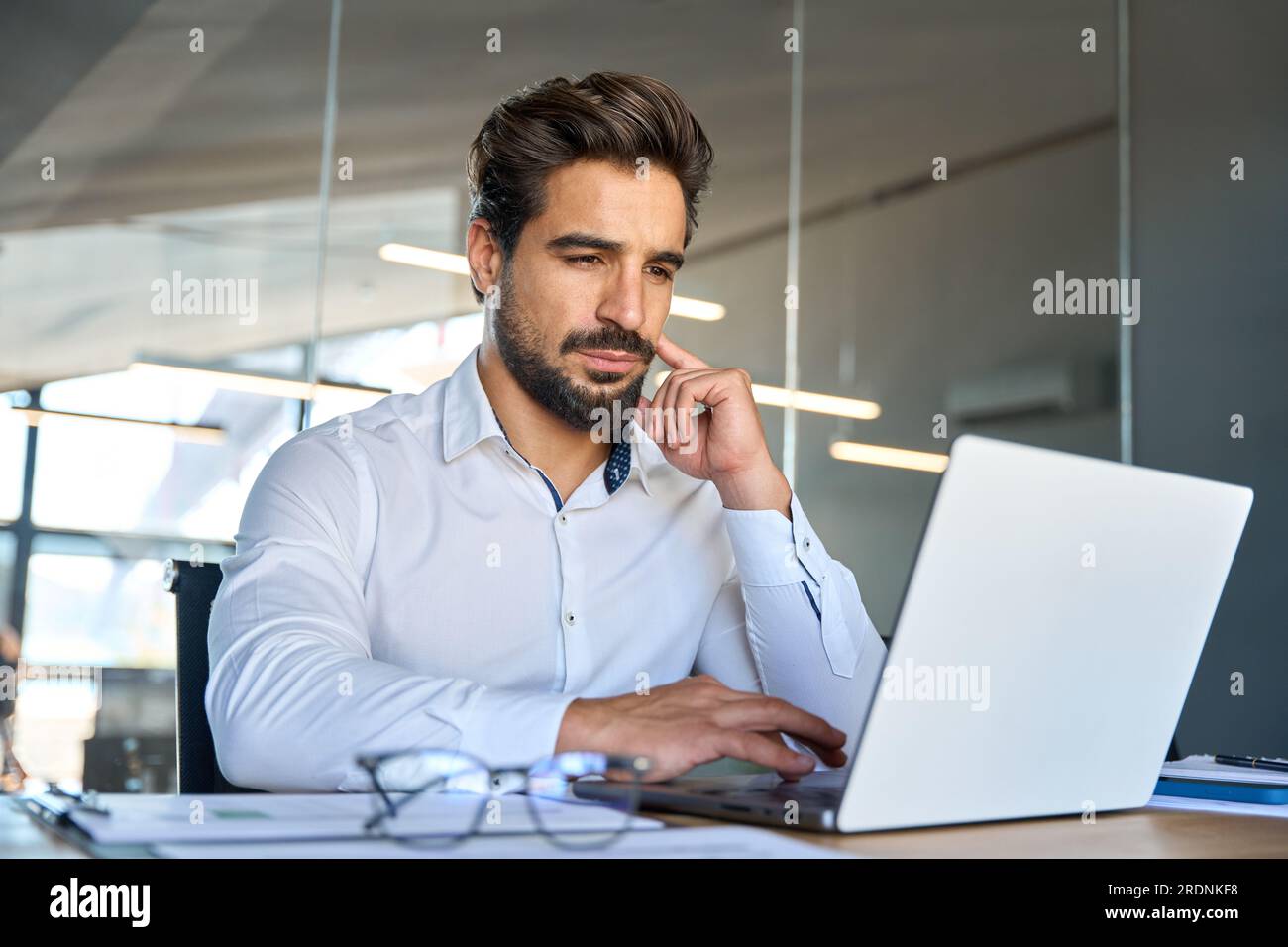 Serious busy young latin hi-res stock photography and images - Alamy