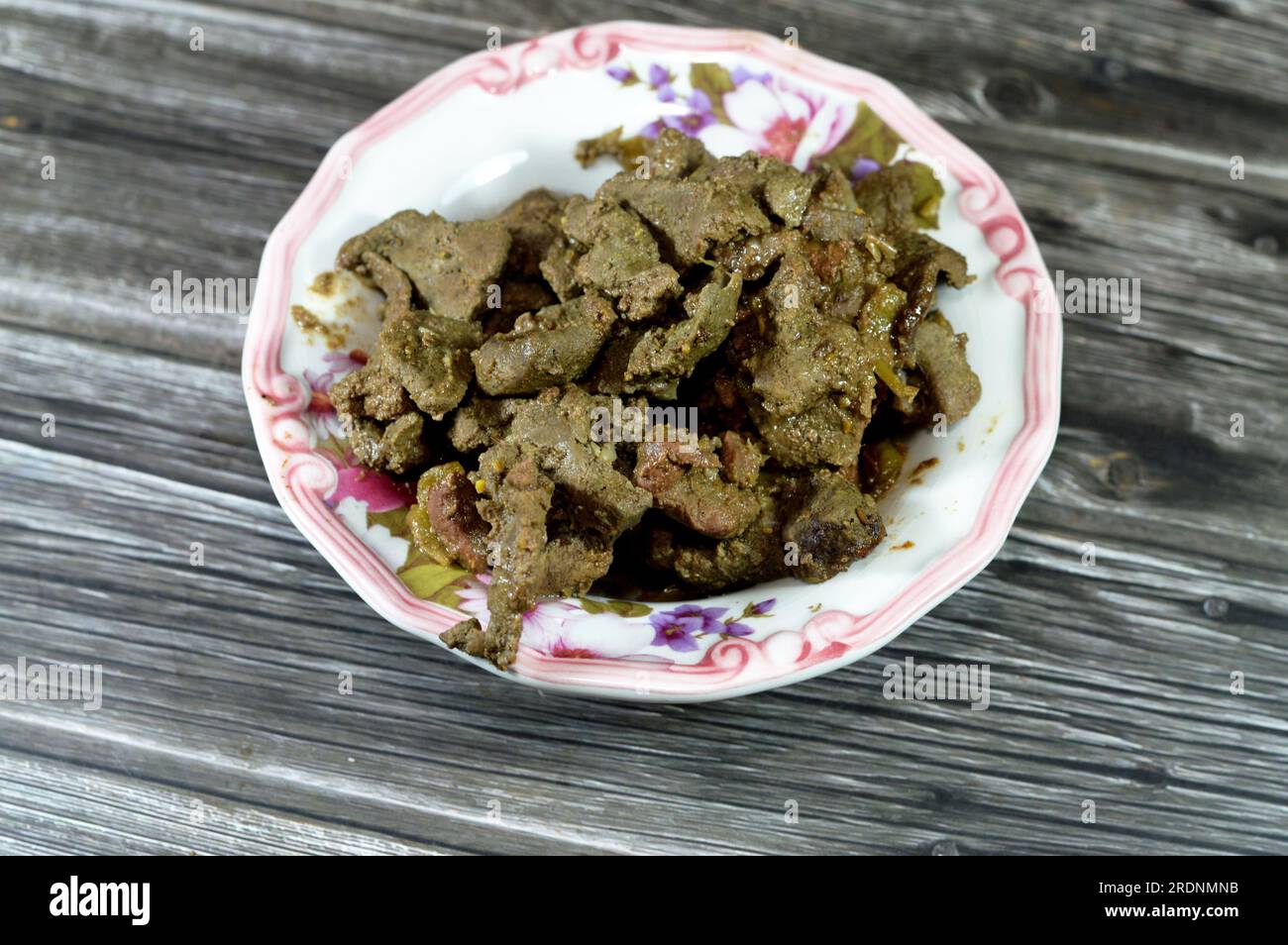 Grilled beef liver sliced in pieces and cooked with oil, white vinegar ...