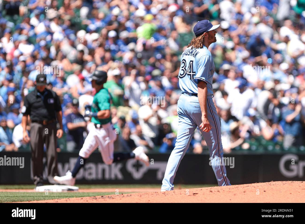 Toronto Blue Jays starting pitcher Kevin Gausman (34) looks on as ...