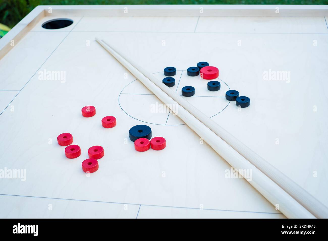 Novuss table with discs and cue stics Stock Photo - Alamy
