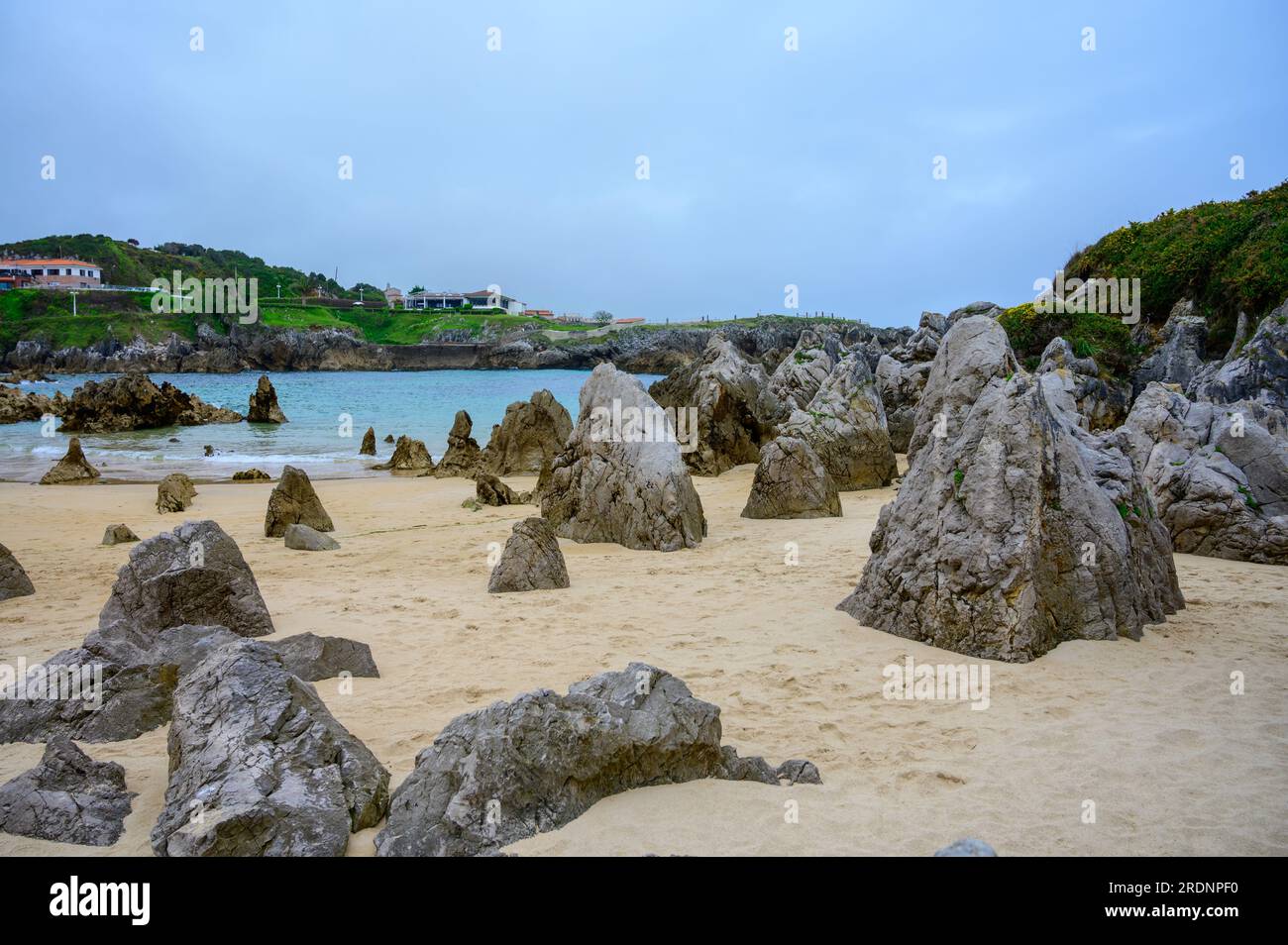 View on rocks on Playa de Toro in Llanes, Green coast of Asturias ...