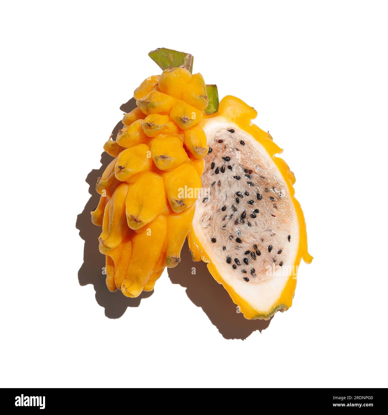 Ripe yellow pitahaya fruit on white background, cut in half, hard light ...