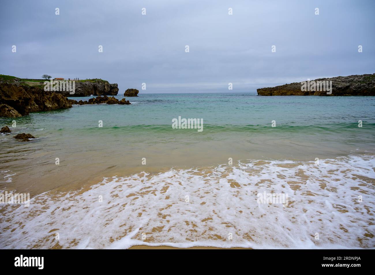 View on rocks on Playa de Toro in Llanes, Green coast of Asturias ...