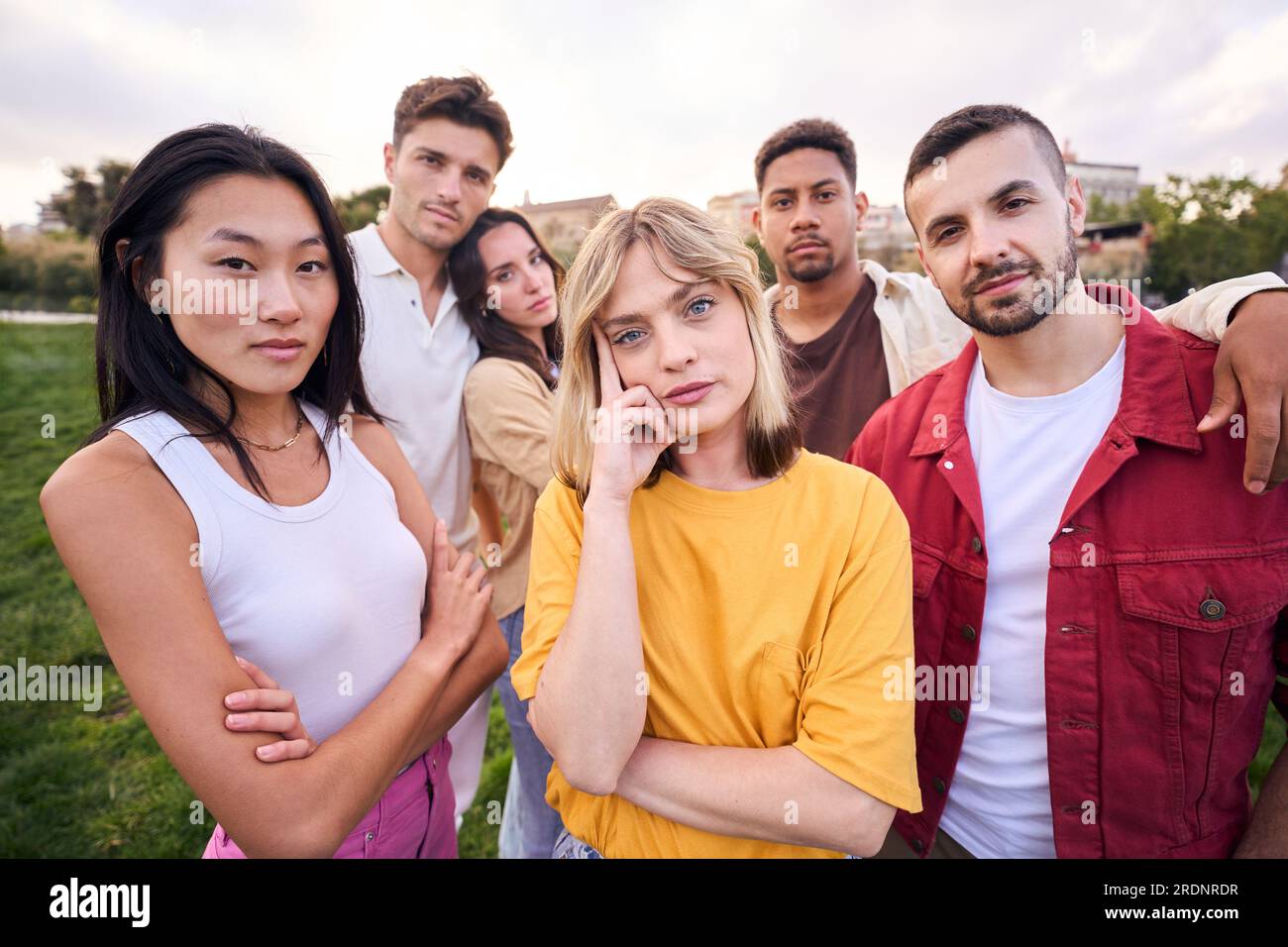 Taking life very seriously. Group of casually dressed young adults ...