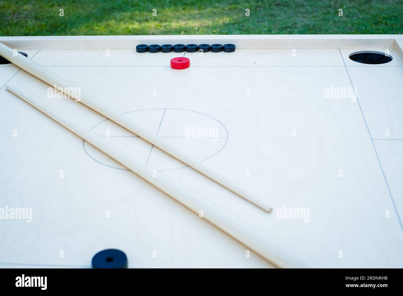 Novuss table with discs and cue stics Stock Photo - Alamy