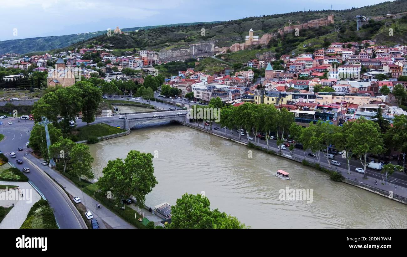 Aerial view on old Tbilisi and Kura river with metekhi bridge and ...
