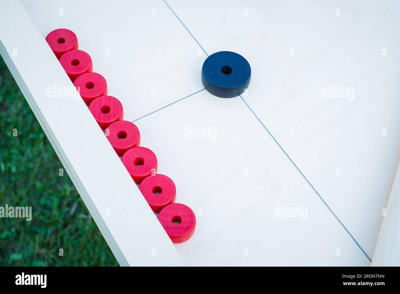 Novuss table with discs and cue stics Stock Photo - Alamy