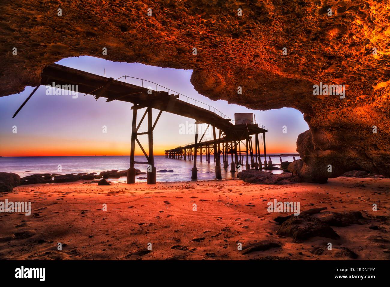 Scenic eroded sea cave on Middle camp beach of Australian coast at ...