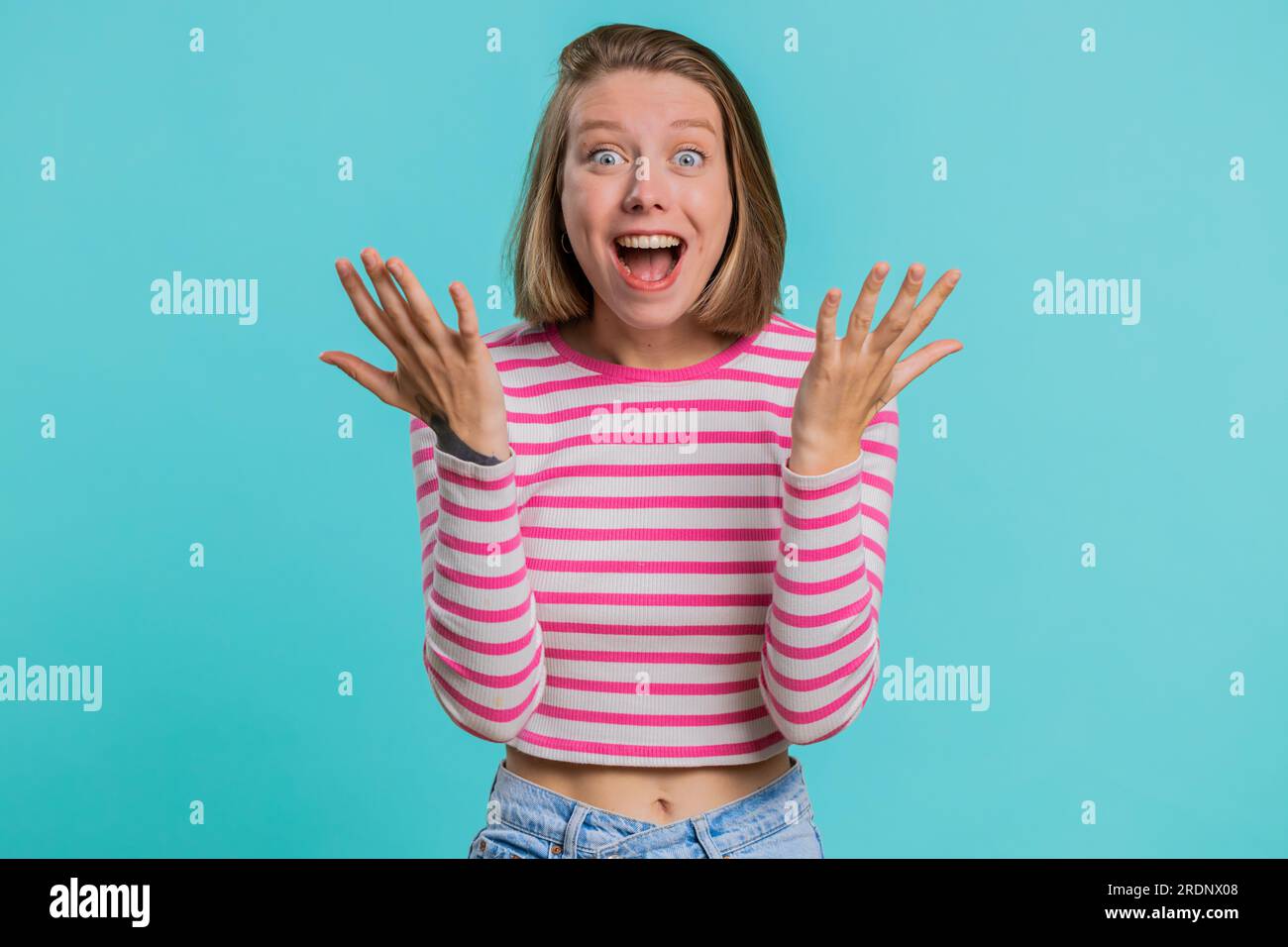 Oh my God, Wow. Excited amazed winner woman raising hands in surprise ...