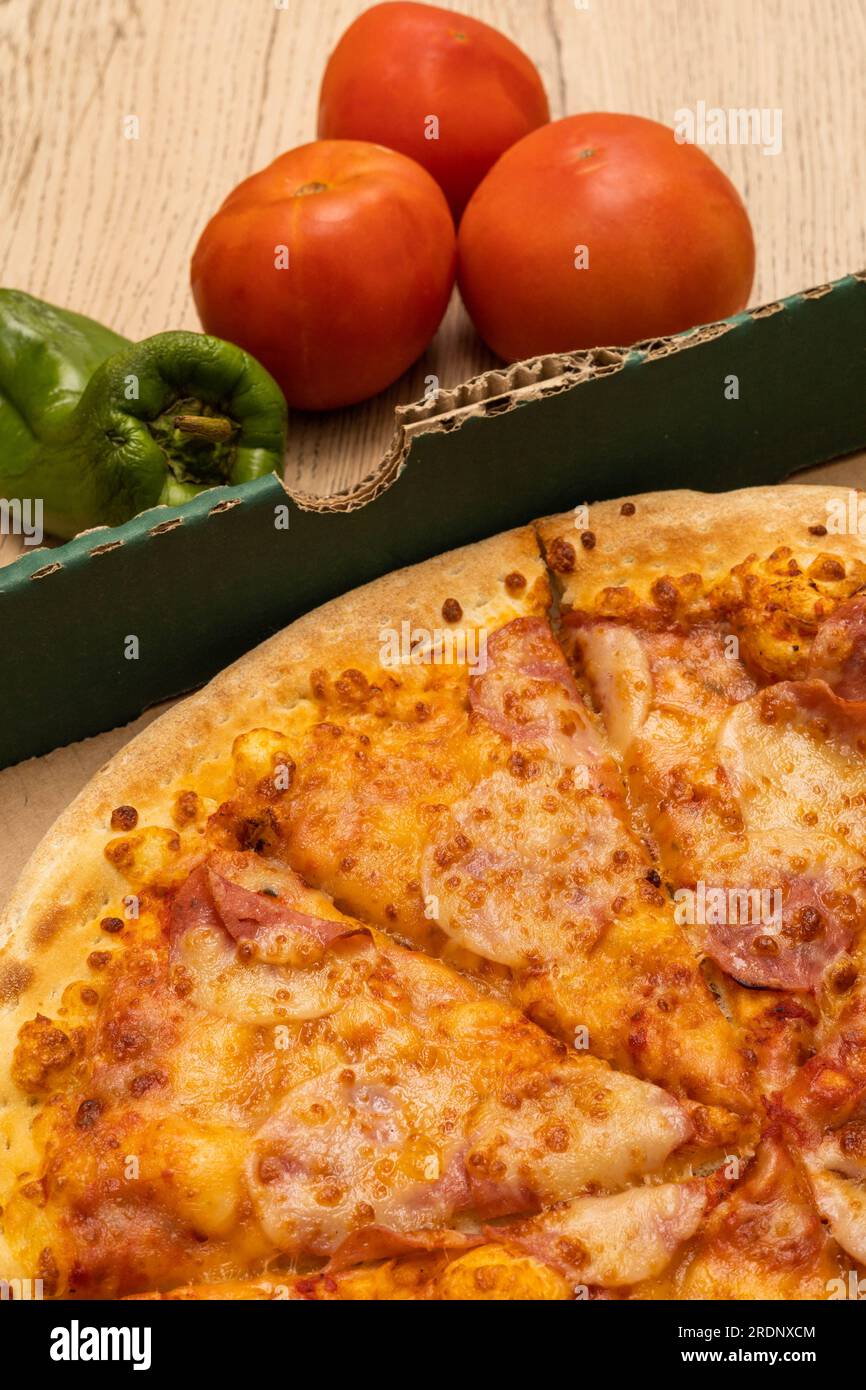 ready-to-eat pizza packed in its box, restaurant menu with fast food ...