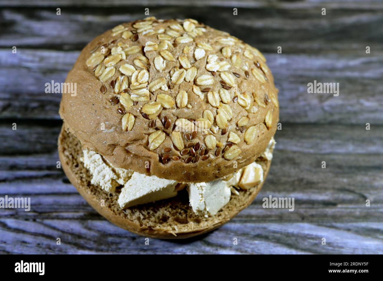 Traditional tahini halva with peanuts or Halawa Tahiniya in a wheat oat ...