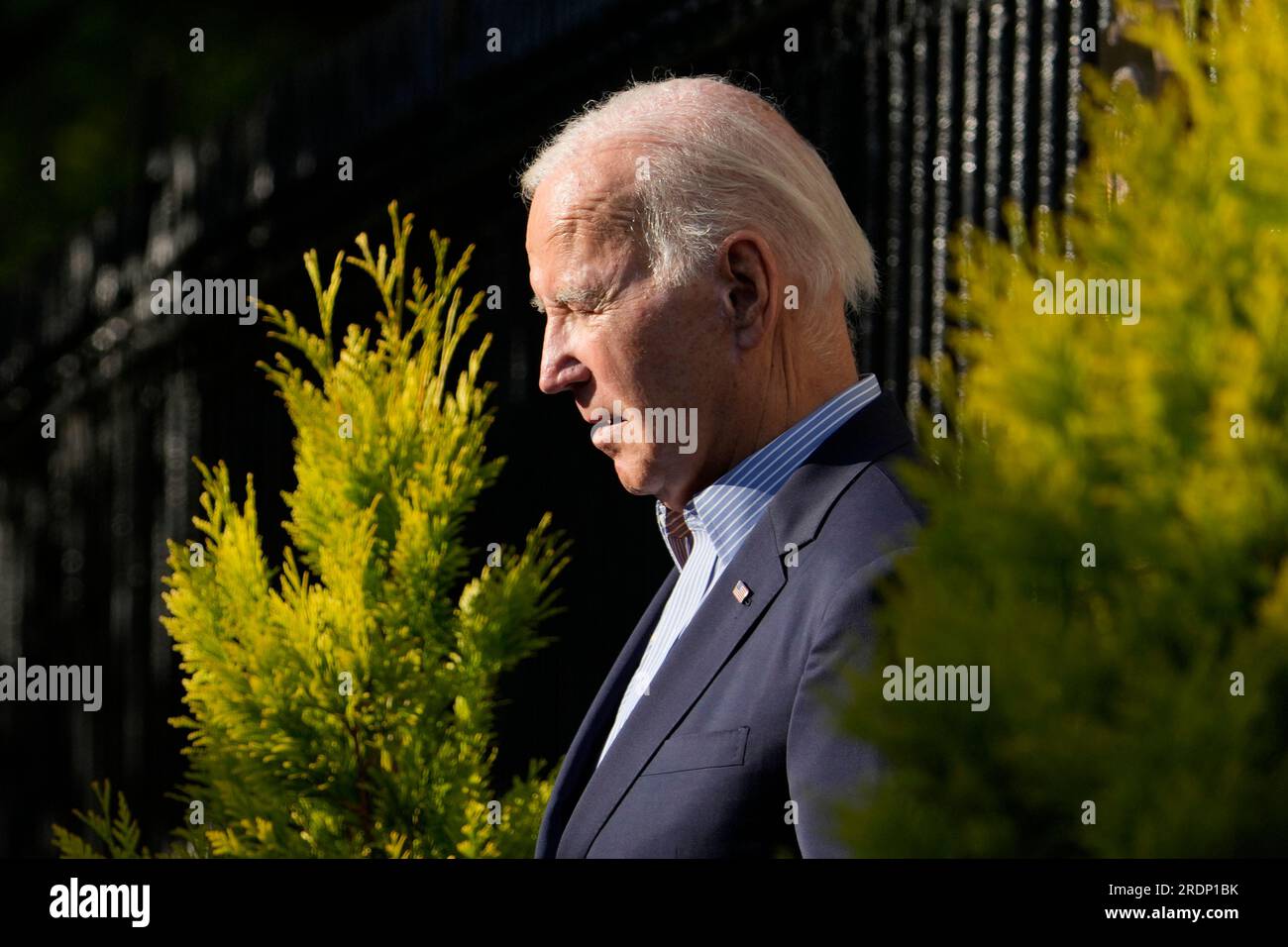 President Joe Biden walks to his motorcade as he leaves Holy Trinity ...
