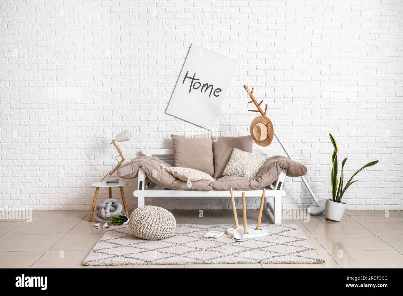 Couch with tables and rack in messy living room Stock Photo - Alamy