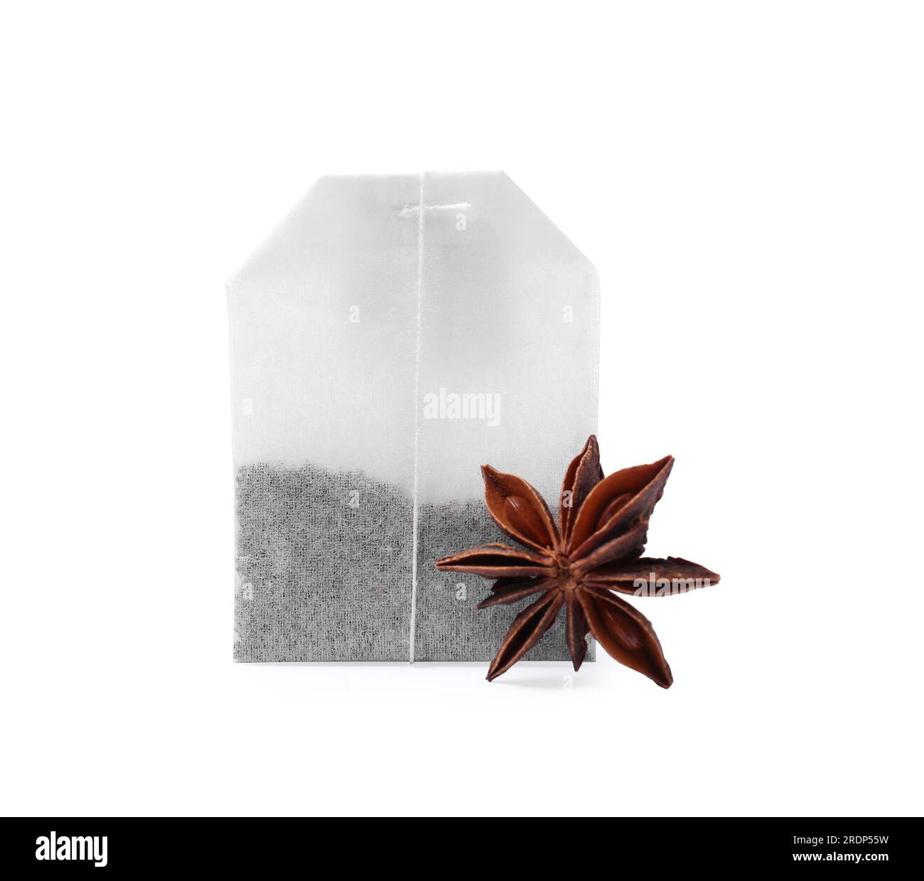 New tea bag and anise star on white background Stock Photo - Alamy