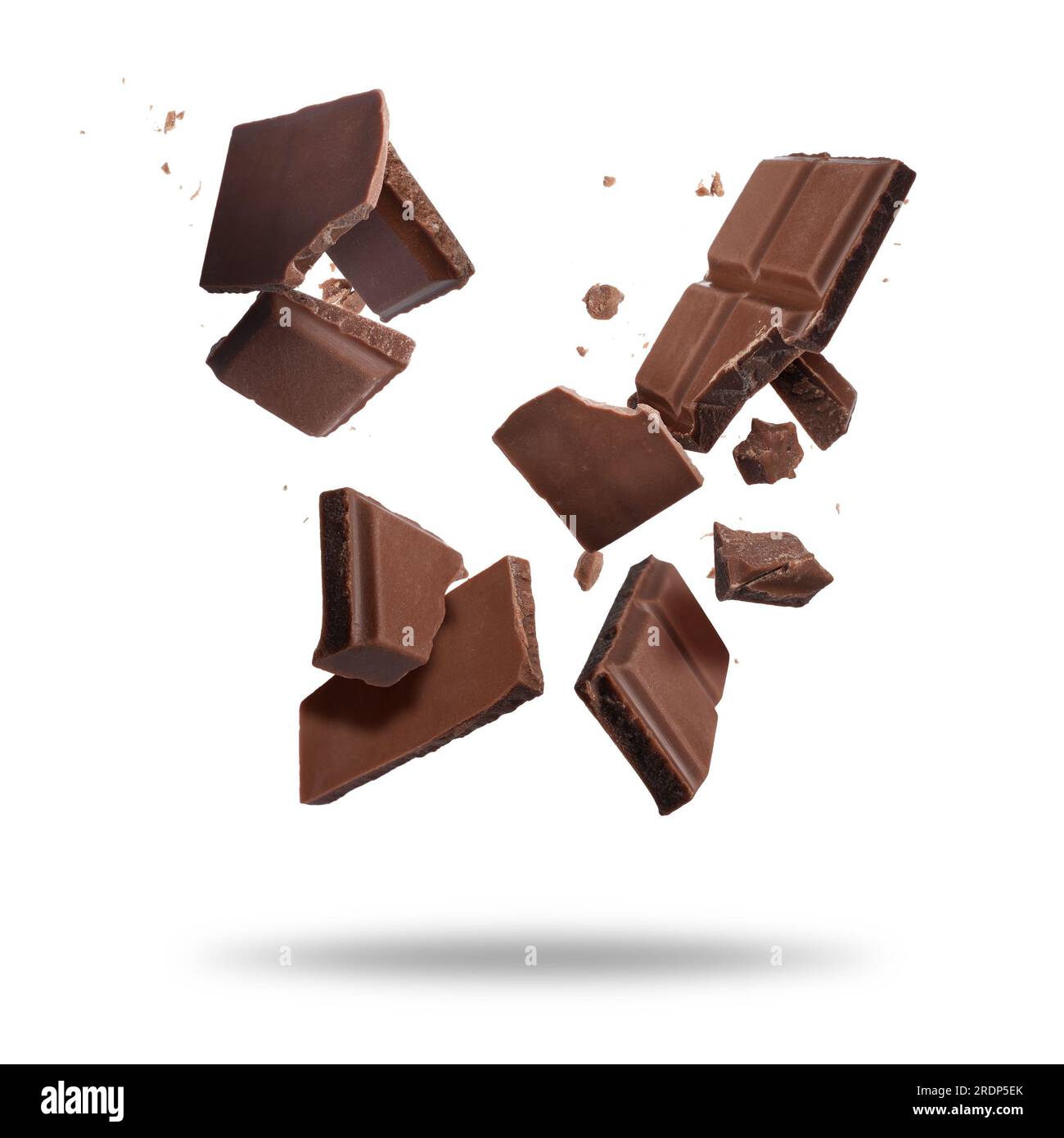 Broken chocolate bar pieces falling on white background Stock Photo - Alamy