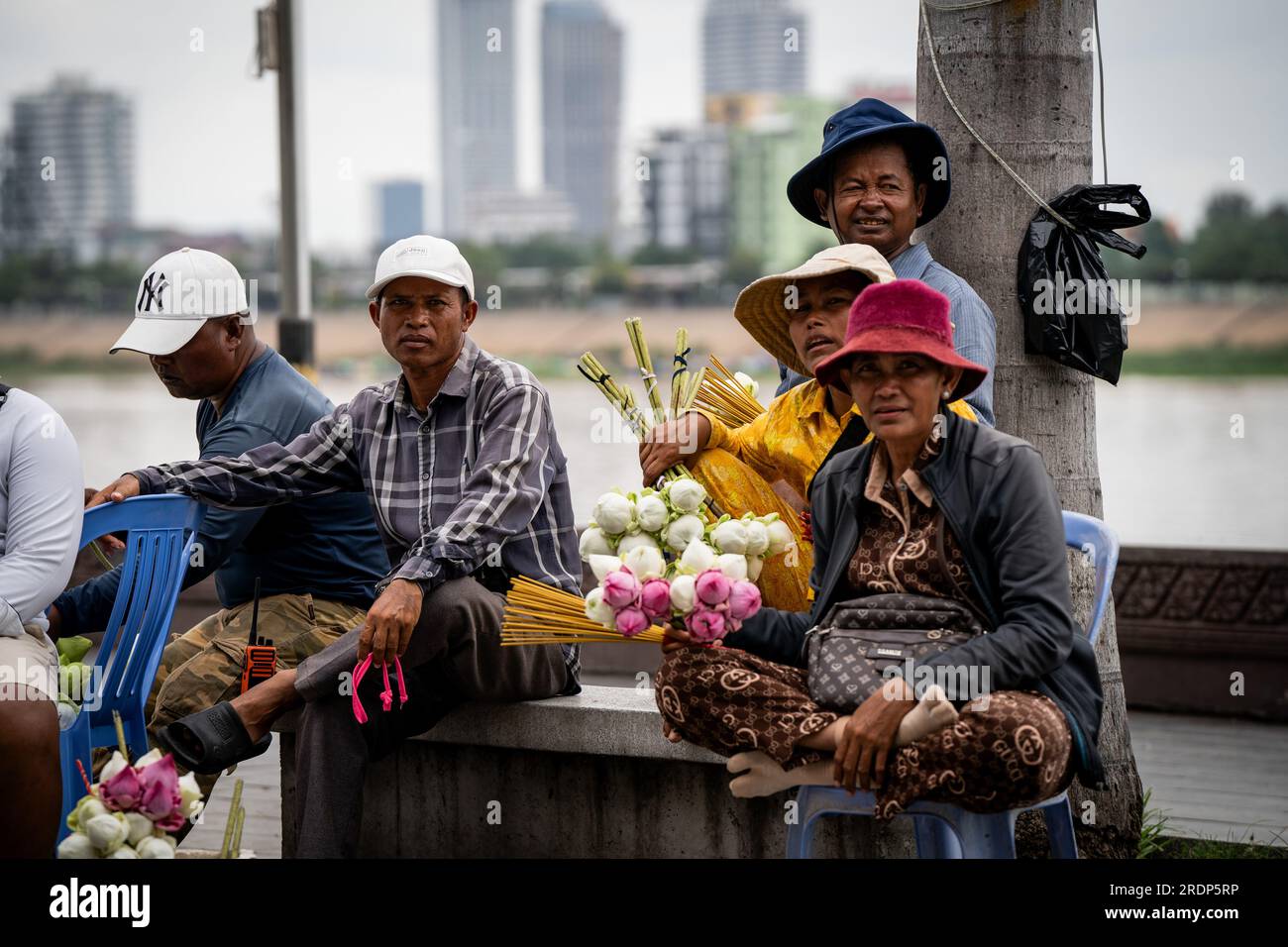 Phnom Penh, Cambodia. 22nd July, 2023. Flower vendors sell their ...