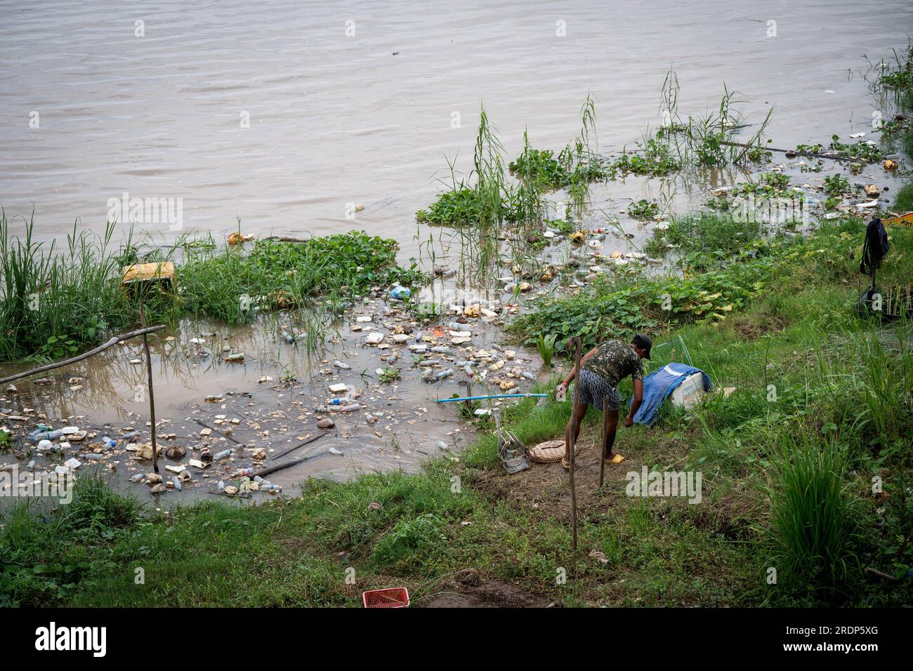 Phnom Penh, Cambodia. 22nd July, 2023. A man seen collecting plastic ...
