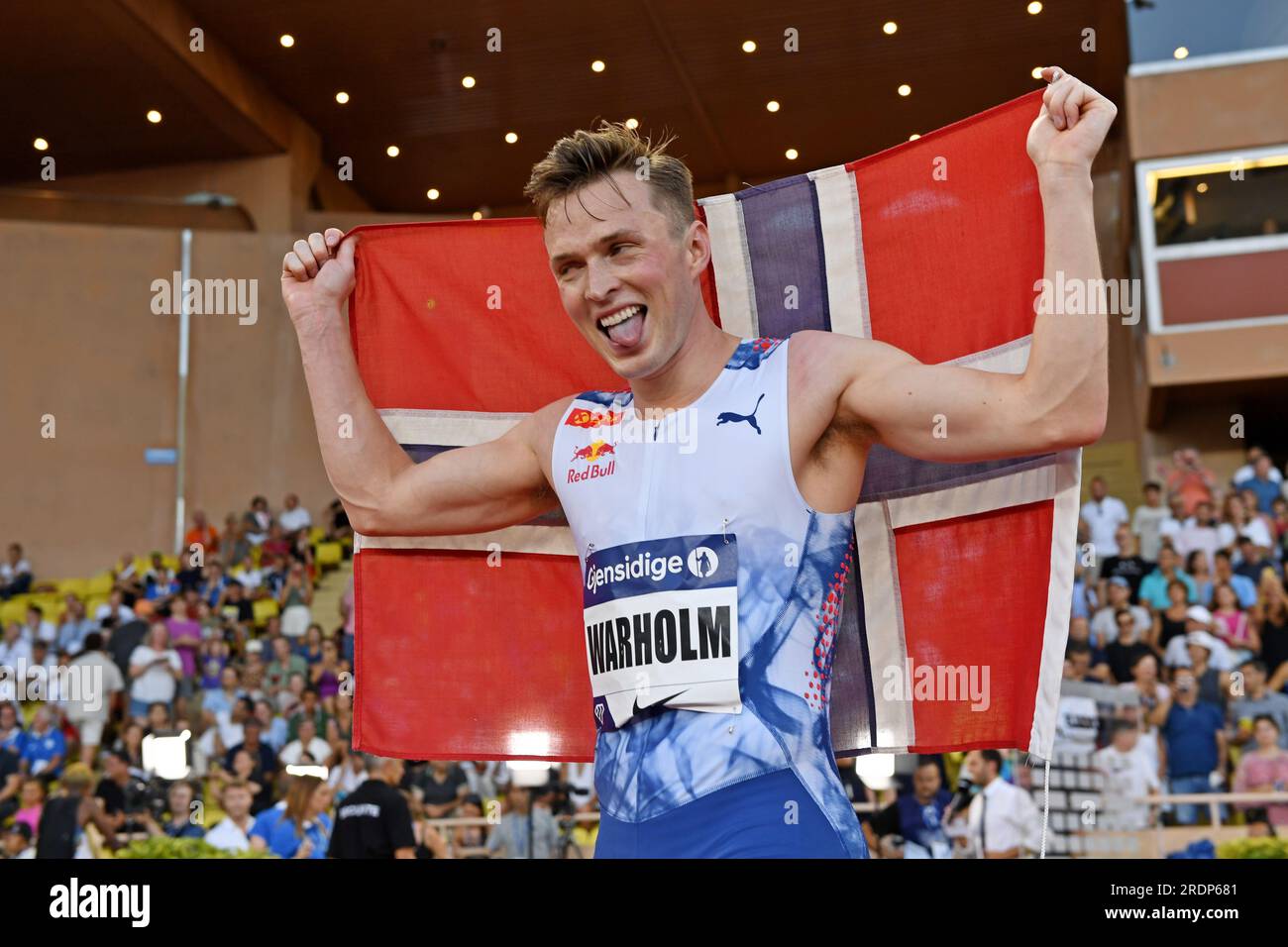 Karsten Warholm (NOR) poses with Norwegian flag after winning the 400m ...