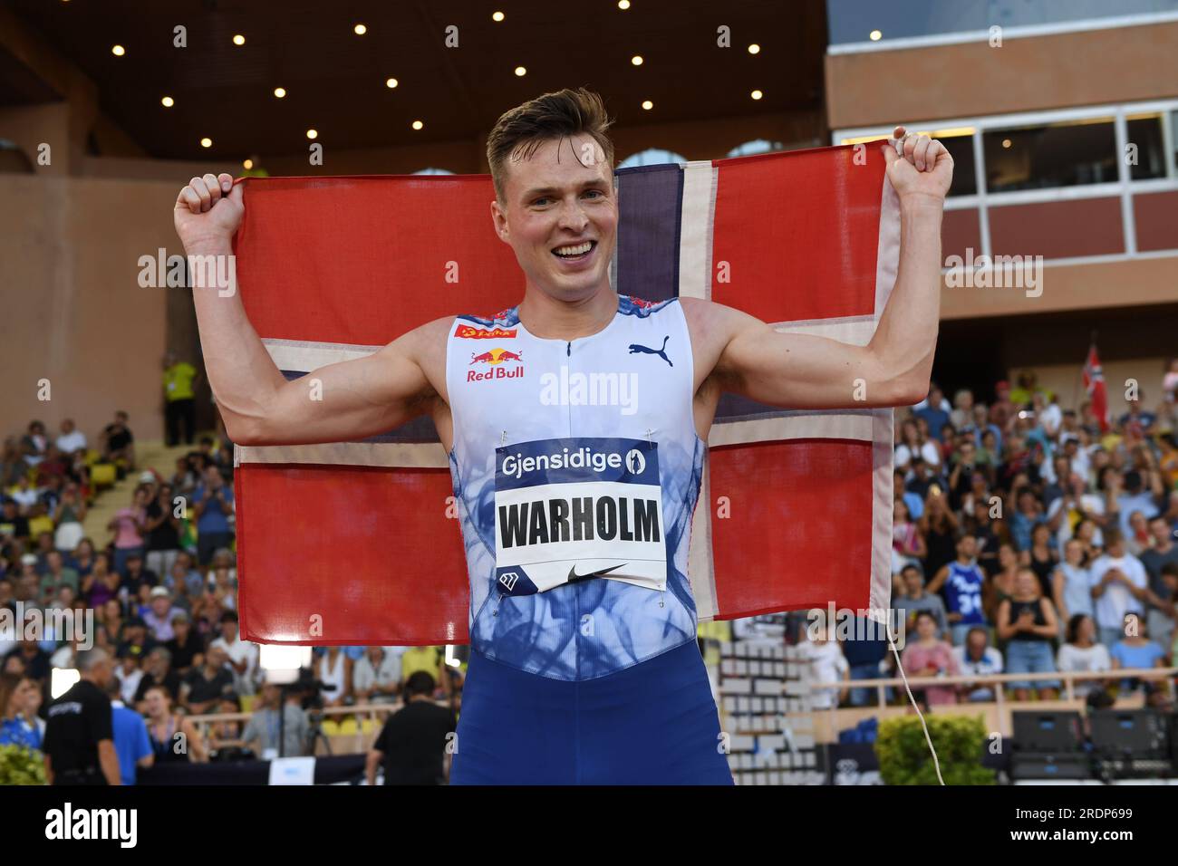 Karsten Warholm (NOR) poses with Norwegian flag after winning the 400m ...