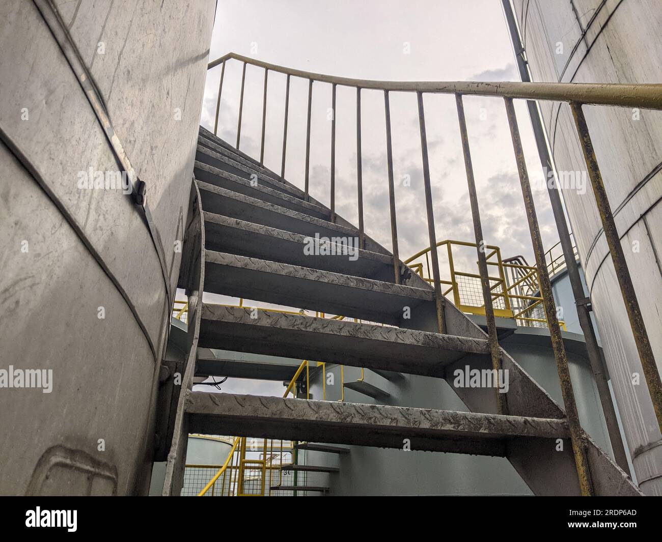 Looks like a tall ladder on an oil storage tank inside a factory Stock ...