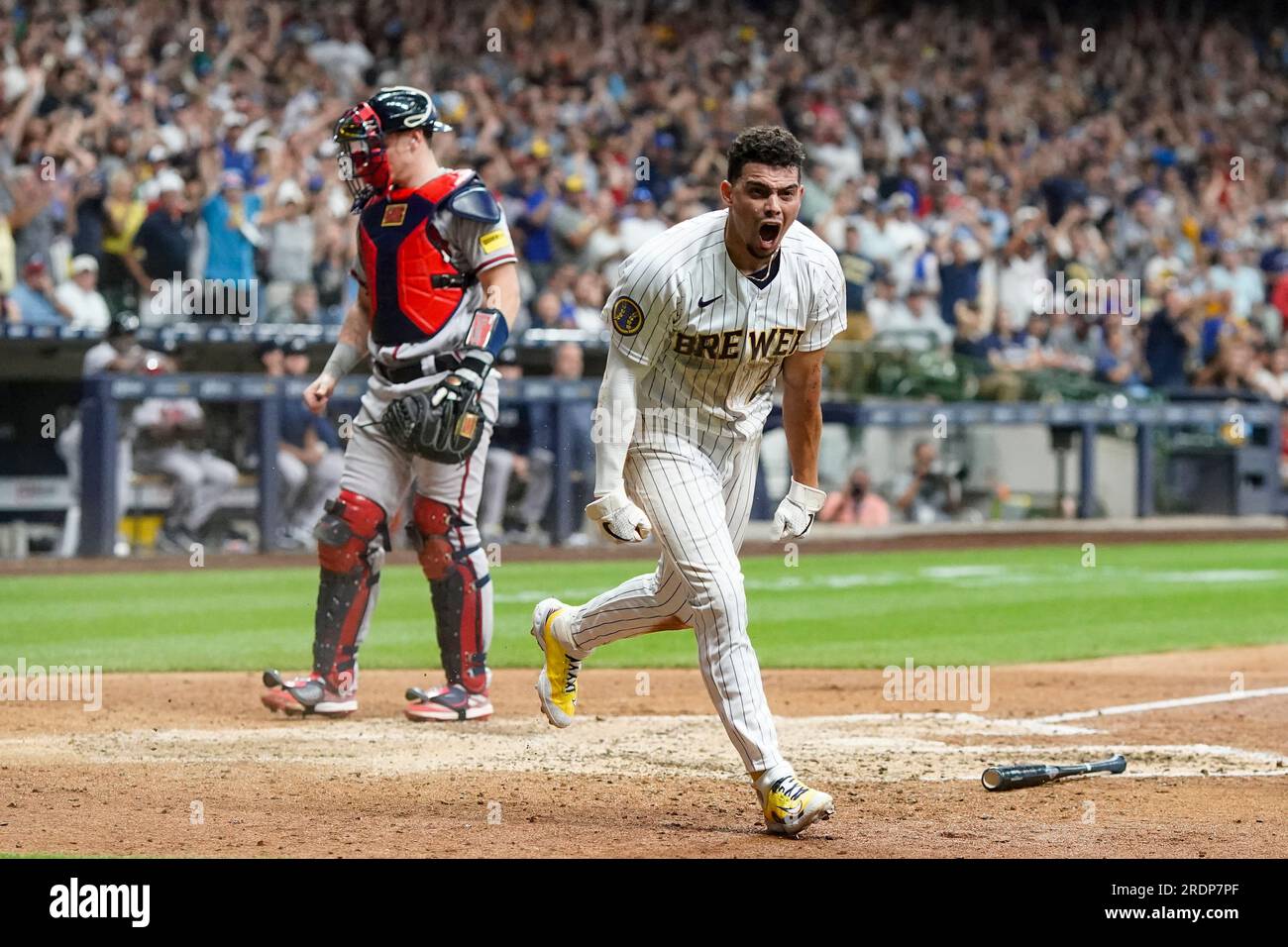 Milwaukee Brewers' Willy Adames reacts after scorinfg past Atlanta ...