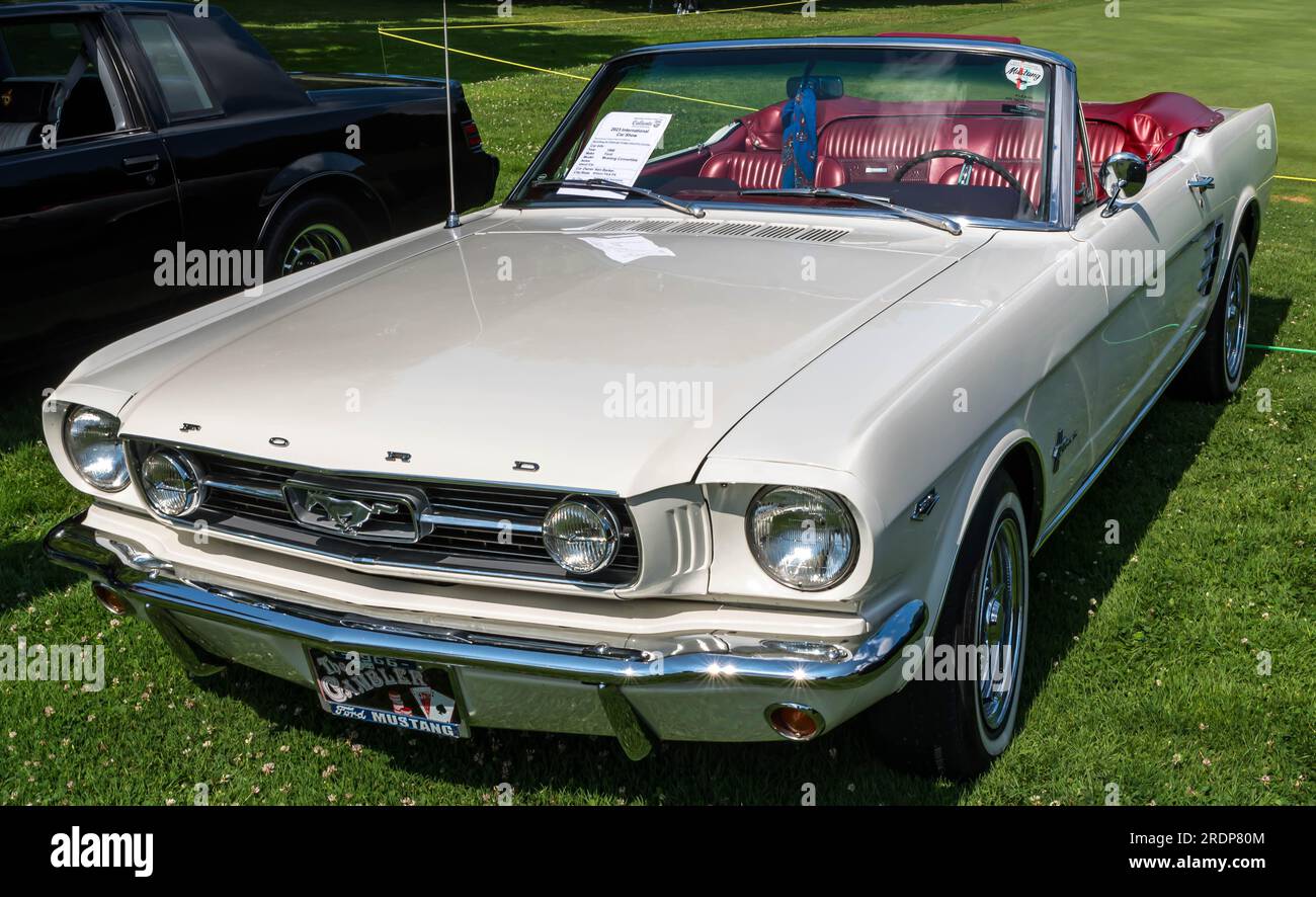 A 1966 white Ford Mustang on display at a car show in Pittsburgh ...