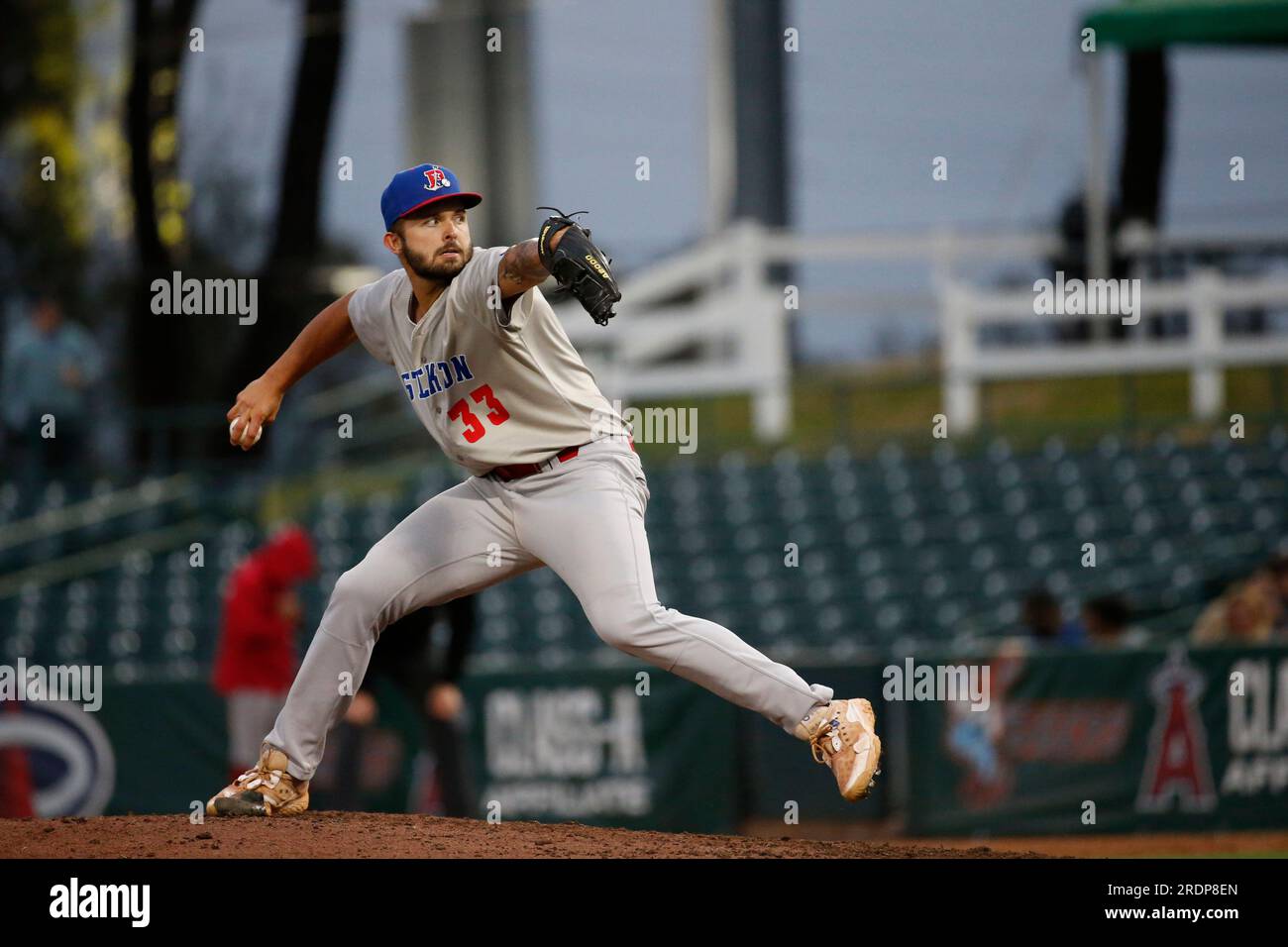 Dallas Woofolk (33) of the Stockton Ports pitches against the Inland ...