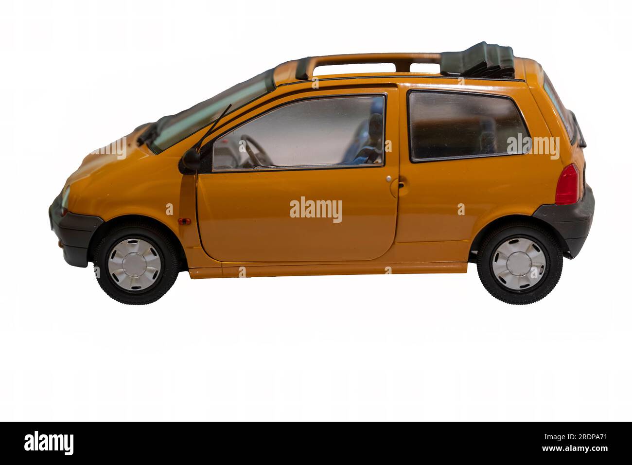 Close up of a model orange compact car with retractable roof. Isolated ...