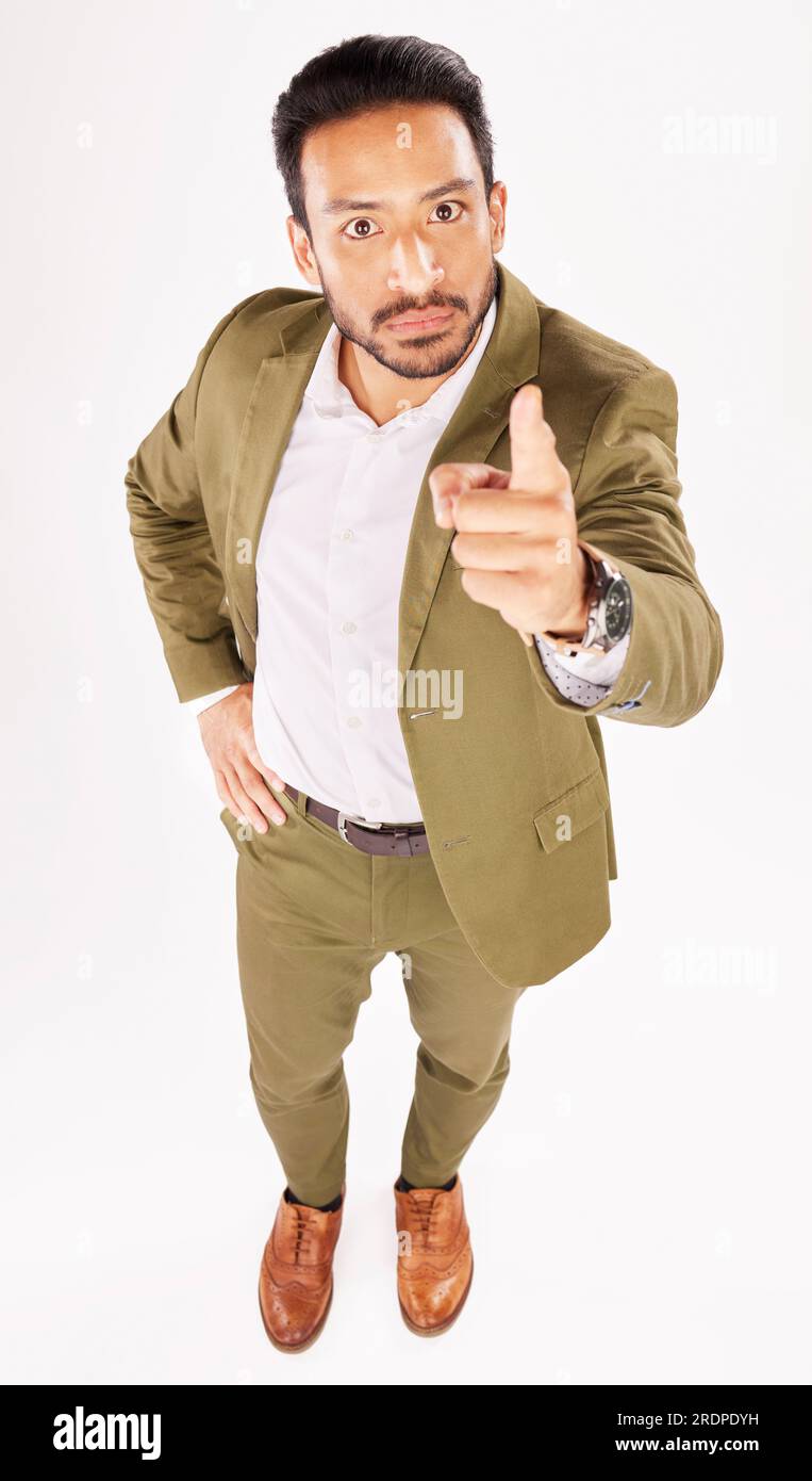 Portrait, pointing and scolding with a business man in studio on a ...