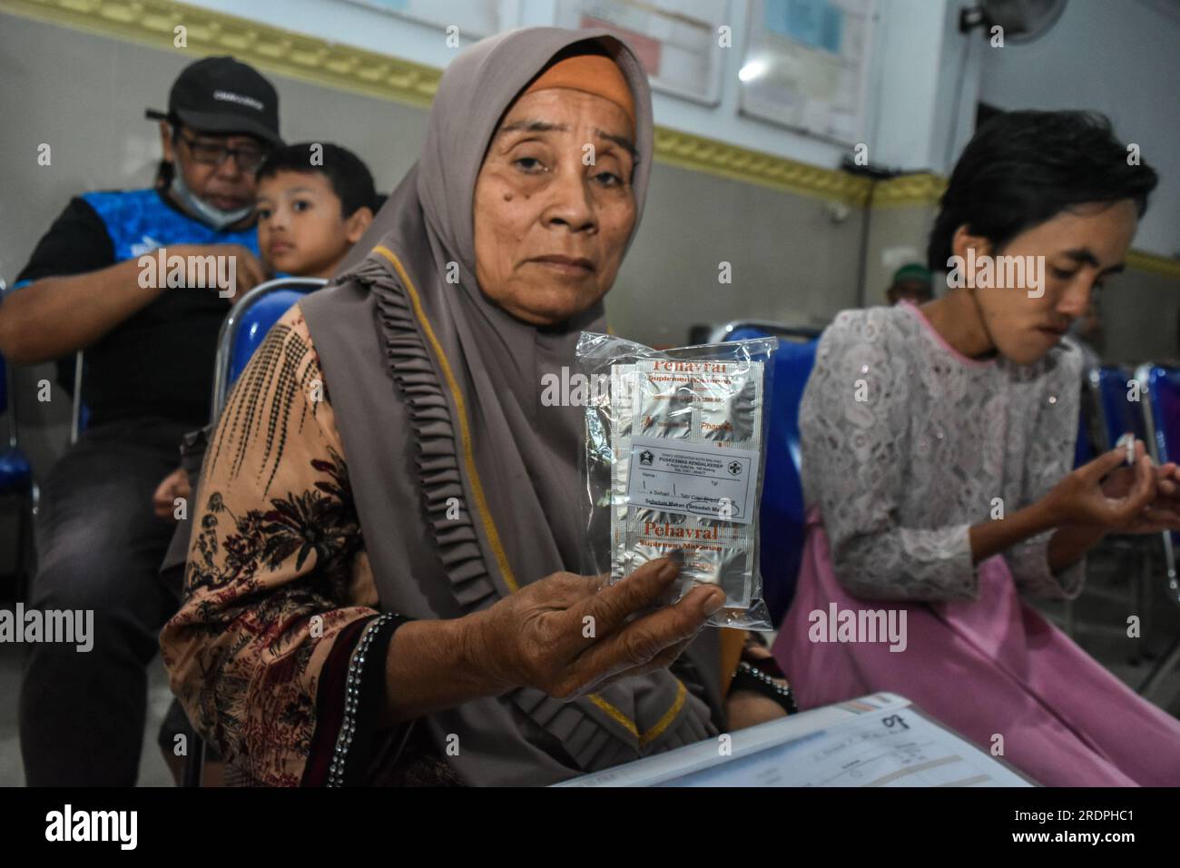 July 22, 2023, Malang, East Java, Indonesia: A patient shows medicines ...