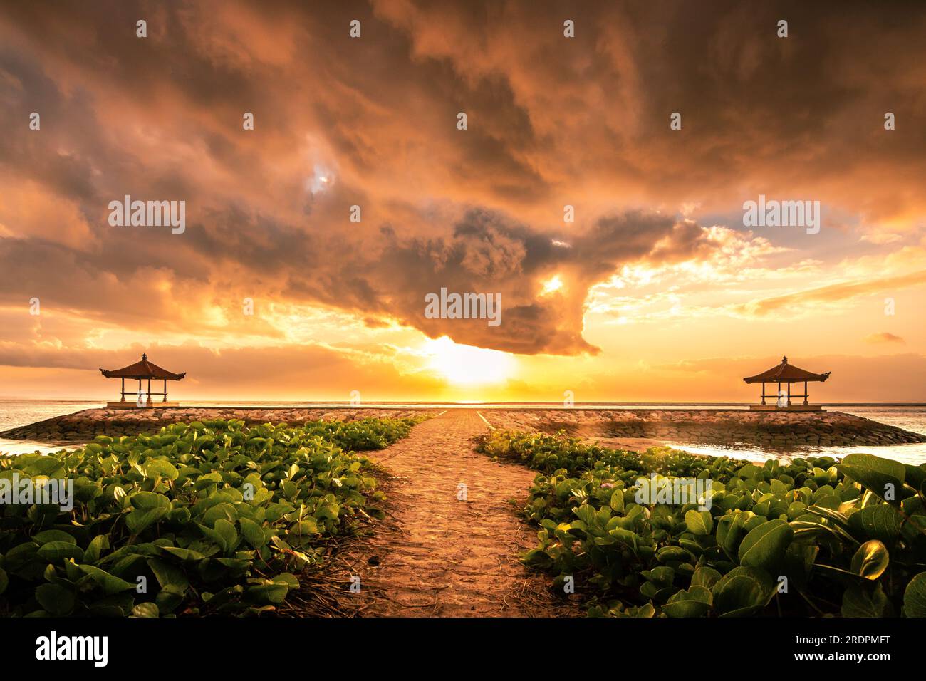 Sunset or sunrise on the beach in Bali in Sanur. beautiful temples in ...