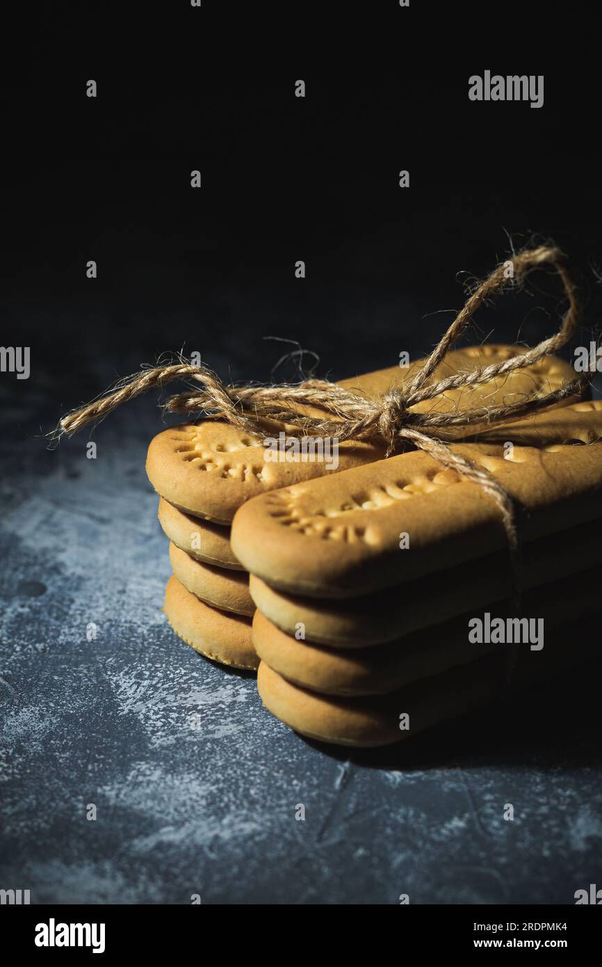 Biscuits tied with a rope on an abstract background Stock Photo - Alamy