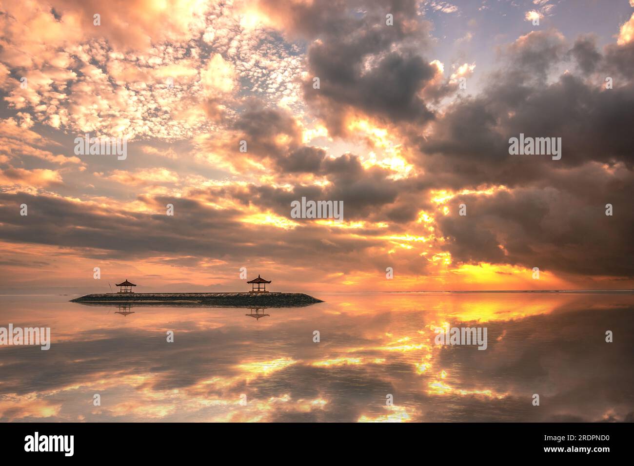 Sunset or sunrise on the beach in Bali in Sanur. beautiful temples in ...