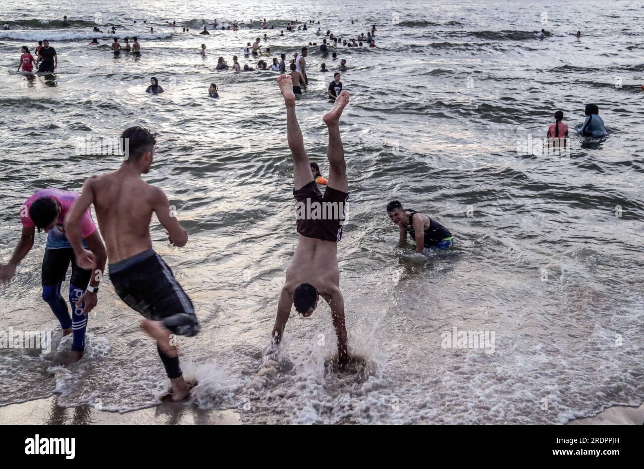 Gaza, Palestine. 22nd July, 2023. Palestinians spend time at the beach ...