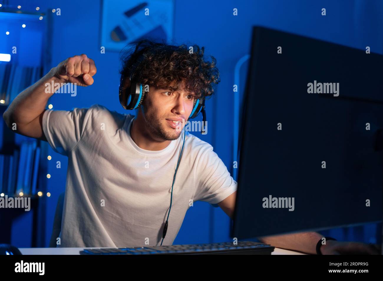 Angry arabic guy gamer showing fist and angry at losing game while ...