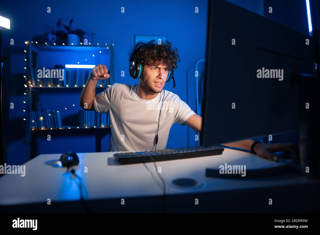 Angry arabic guy gamer showing fist and angry at losing game while ...