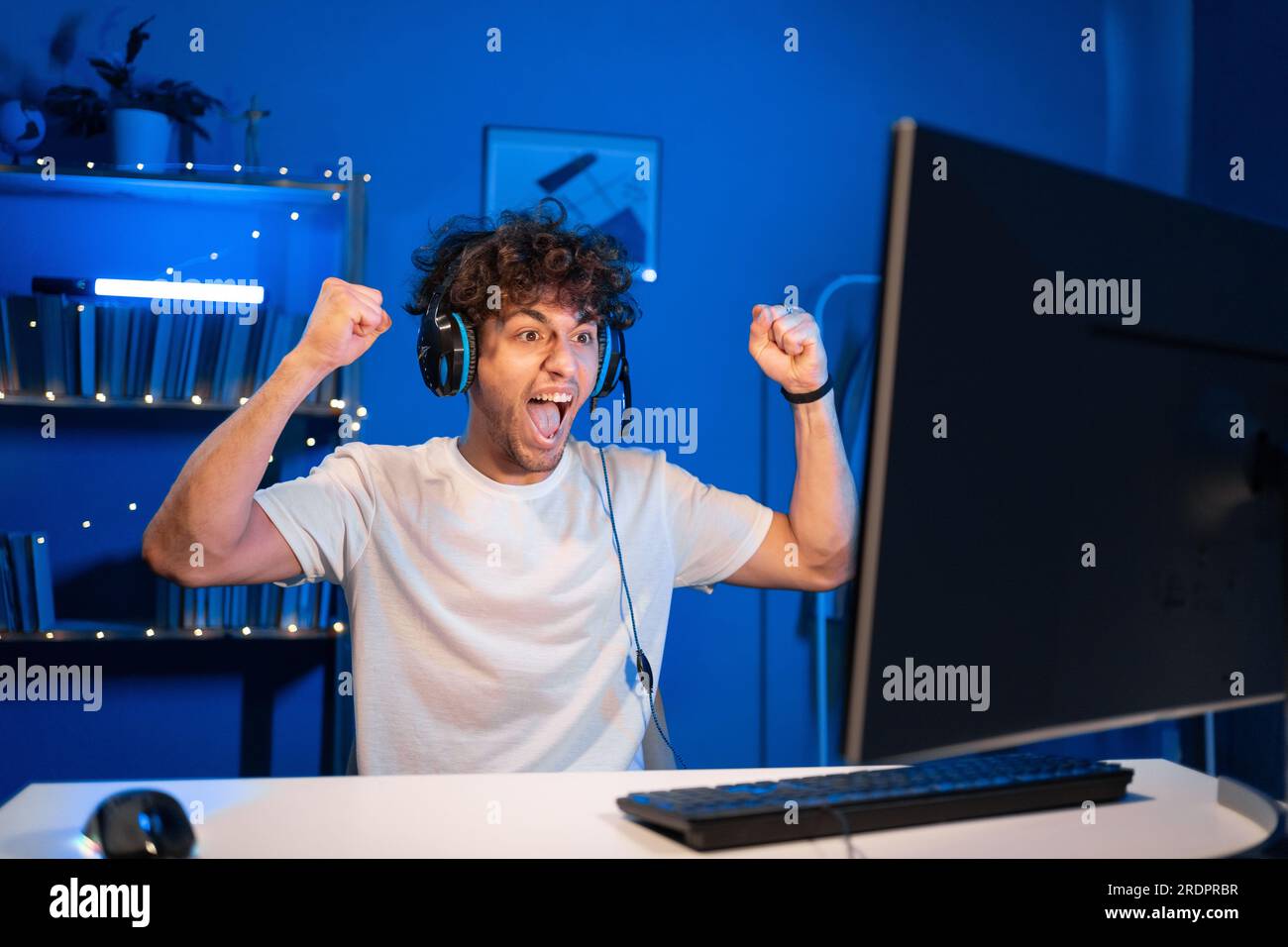 Male gamer playing shooter in hi-res stock photography and images - Alamy