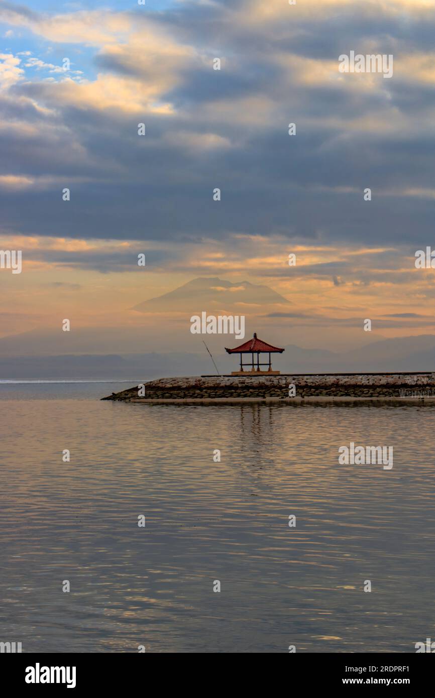 Sunset or sunrise on the beach in Bali in Sanur. beautiful temples in ...